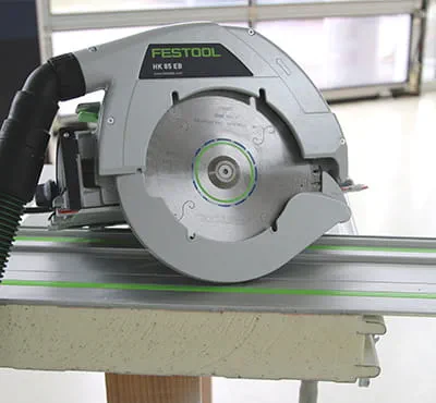 Cutting and machining layered boards according to guide